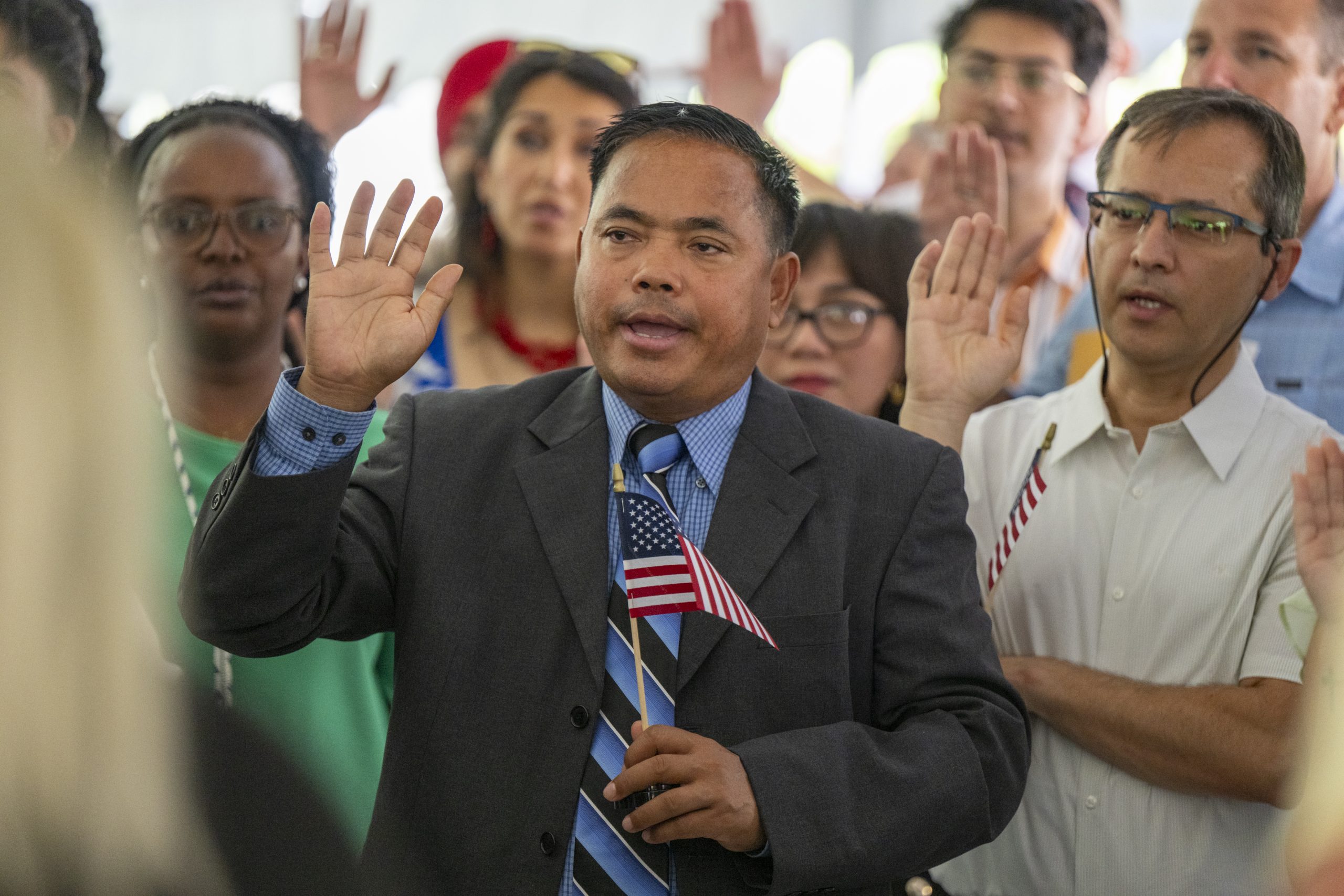 See nearly 100 people become U.S. citizens